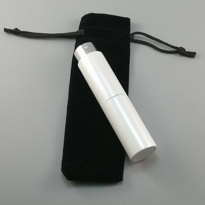 China NEW Round White Marble Pattern Velvet Bag 8ml 10ml Aluminum Twist up Refillable Travel Perfume Atomizer for sale