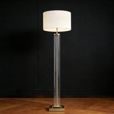 China Modern Minimalist Brass Base Floor Lamp with Crystal-clear Glass Column and Adjustable Height for sale