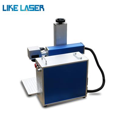 Cina Negozi di abbigliamento Macchine di marcatura laser a tornio mini metallo con velocità di marcatura 0-7000mm/S in vendita