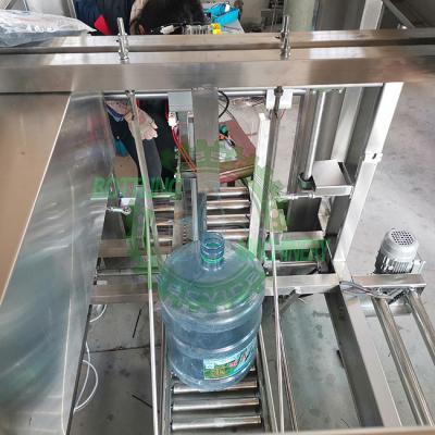 中国 5ガロン水びん詰めにする機械の自動プラスチック フィルムのBaggingの包装業者 販売のため