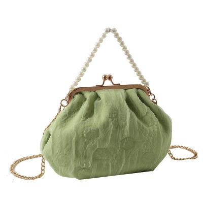 China 2024 NEW RETRO FAIRY SOLID COLOR SMALL BAG WHITE HAND PEARL BAG WOMEN'S NET YARN INS SIMPLE CROSSBODY BAG for sale