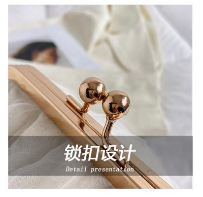 China 2024 NEW RETRO FAIRY SOLID COLOR SMALL BAG WHITE HAND PEARL BAG WOMEN'S NET YARN INS SIMPLE CROSSBODY BAG for sale