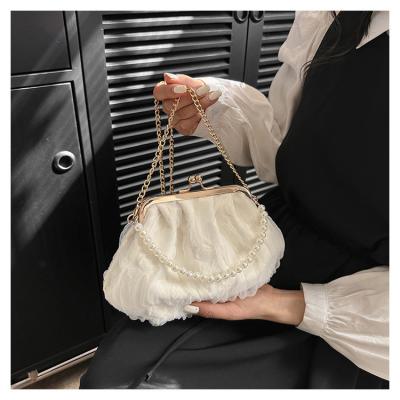 China 2024 NEW RETRO FAIRY SOLID COLOR SMALL BAG WHITE HAND PEARL BAG WOMEN'S NET YARN INS SIMPLE CROSSBODY BAG for sale