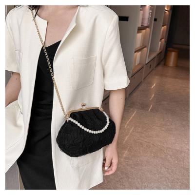 China 2024 NEW RETRO FAIRY SOLID COLOR SMALL BAG WHITE HAND PEARL BAG WOMEN'S NET YARN INS SIMPLE CROSSBODY BAG for sale