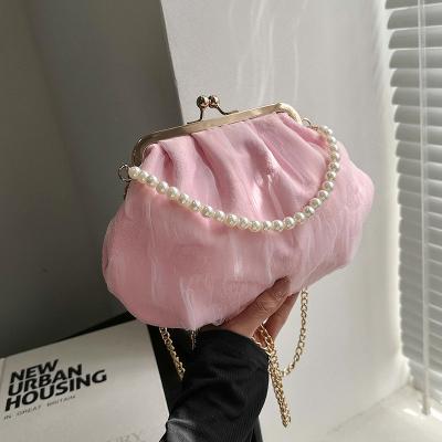China 2024 NEW RETRO FAIRY SOLID COLOR SMALL BAG WHITE HAND PEARL BAG WOMEN'S NET YARN INS SIMPLE CROSSBODY BAG for sale