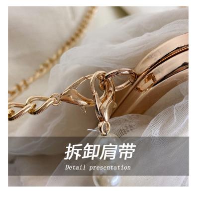 China 2024 NEW RETRO FAIRY SOLID COLOR SMALL BAG WHITE HAND PEARL BAG WOMEN'S NET YARN INS SIMPLE CROSSBODY BAG for sale