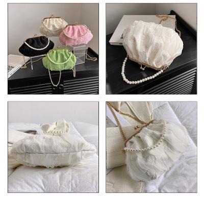 China 2024 NEW RETRO FAIRY SOLID COLOR SMALL BAG WHITE HAND PEARL BAG WOMEN'S NET YARN INS SIMPLE CROSSBODY BAG for sale