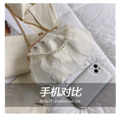 China 2024 NEW RETRO FAIRY SOLID COLOR SMALL BAG WHITE HAND PEARL BAG WOMEN'S NET YARN INS SIMPLE CROSSBODY BAG for sale