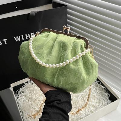 China 2024 NEW RETRO FAIRY SOLID COLOR SMALL BAG WHITE HAND PEARL BAG WOMEN'S NET YARN INS SIMPLE CROSSBODY BAG for sale