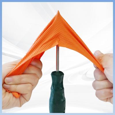 Cina I guanti eliminabili arancio del lavoro del nitrile spolverizzano Diamond Texture Industrial Nitrile Gloves libero in vendita