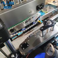 China Fully Automatic Double Side Labeling Machine For Flat Round Bottle for sale