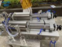 China Horizontal Two Nozzle Piston Liquid Filling Machine 30L Hopper 316L Stainless Steel for sale