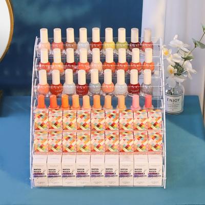 Cina Scalinata Display 5 6 Livello Cosmetico Bottiglia Rack Organizzatore Vitrina Conteggio Polverizzatore di unghie Mensola di plastica in vendita
