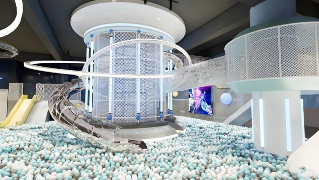 Children playing on space-themed equipment