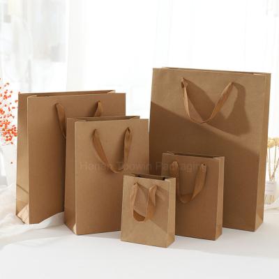 中国 Customized Flexiloop Handle Cardboard Shopping Packaging Paper Bag With Logo For Your 販売のため
