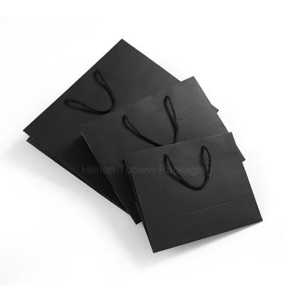 Cina Customized Flexiloop Handle Cardboard Shopping Packaging Paper Bag With Logo For Your in vendita