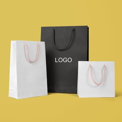 Cina Customized Flexiloop Handle Cardboard Shopping Packaging Paper Bag With Logo For Your in vendita