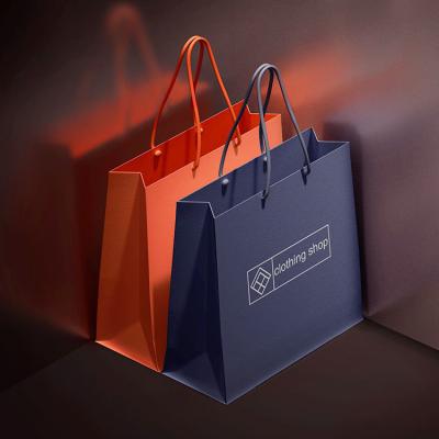 Cina Logo personalizzato accettato Offset stampa carta rosa sacchetto con maniglie in vendita