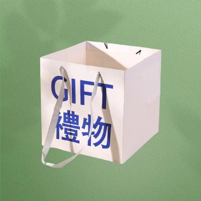 中国 Toowin カスタム 黒いリボン ハンドル ゴールドカード スキンケアショップ 白い紙袋 販売のため