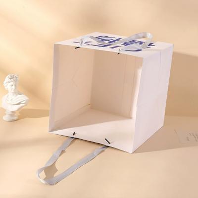 Cina Toowin Custom Black Ribbon Handle Gold Card Skincare Shop Sacchetto di carta bianca per alimentari in vendita