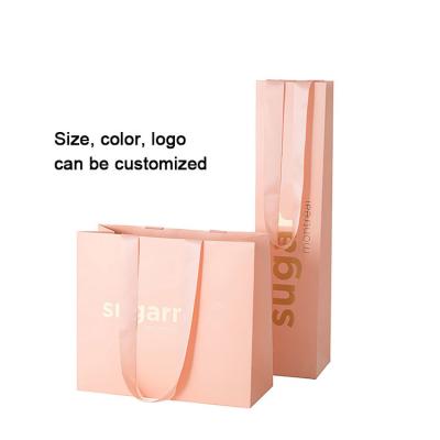 Cina Borsa da asporto con design personalizzato e maniglia a nastro nero in colore bianco avorio in vendita
