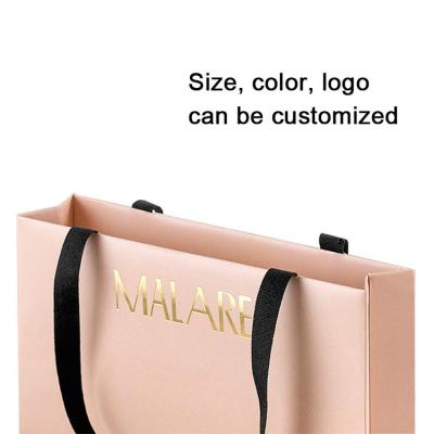 Cina Borsa da asporto con design personalizzato e maniglia a nastro nero in colore bianco avorio in vendita