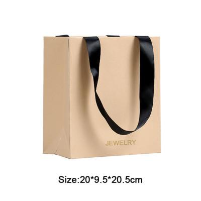 China Custom logo gedrukte papieren zakken voor sieraden en kleding verpakking ivoor karton materiaal Te koop