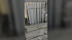 Aluminum billet hanging from the casting pit