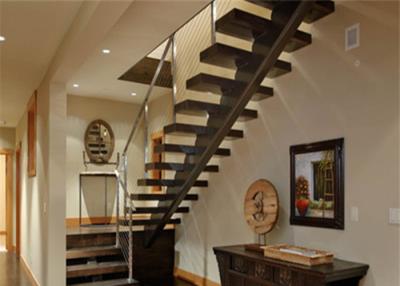 China 304s.s indoor curved wooden staricase with tempered glass balustrade for sale