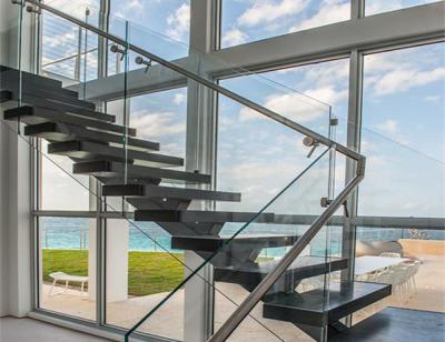 China solid wooden tread straight staircase with tempered clear glass railing for sale