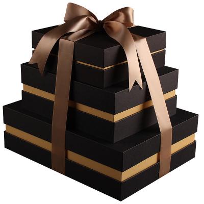 China Stackable Rigid Gift Box Elegant Black Gold Instagrammable Rigid Paper Boxes for sale