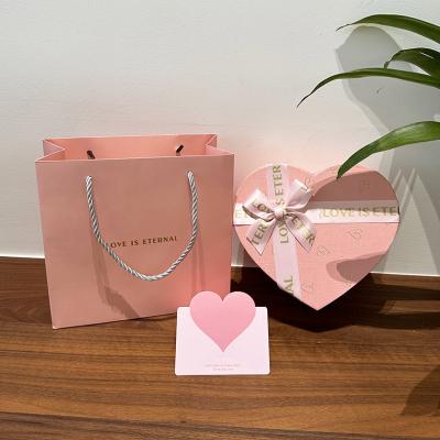 China Greeting Card Rigid Presentation Boxes Pink Heart Box With Tote Bag Customizable for sale