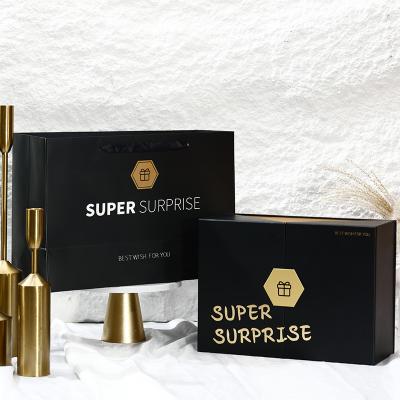 China Surprise Gift Rigid Paper Boxes Double Opening Black Gold Business Perfume Gift Box for sale