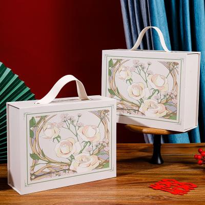 China Camellia Forest Wedding Favor Box Champagne Collapsible Gift Box With Magnetic Closure Floral Design for sale