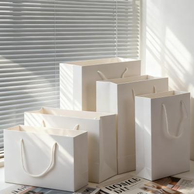 China Cross-border Trade Exquisite White Cardboard Tote Bags Custom Gift Bags Clothing Store Tote Bags for sale