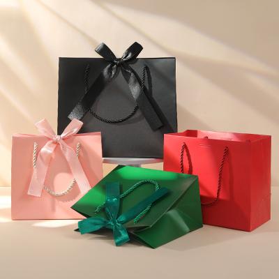 China Luxury Solid Color Gift Bags Premium Kraft Paper Shopping Totes with Ribbon Handles Bulk Stock for Cross Border Trade Ideal for Gifting Retail Packaging for sale