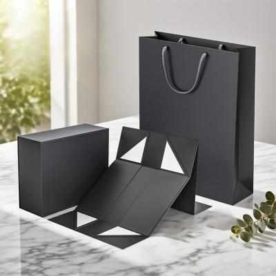 China Luxury Gift Box Shopping Bag Set Premium Cardboard Packaging with Silver Rope Handles Ideal for Festive Gifts Stylish Sturdy Design for sale