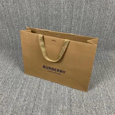 Cina 200pcs al nastro dei sacchi di carta dell'abbigliamento di timbratura di oro 500pcs tratta i sacchetti della spesa di Kraft in vendita