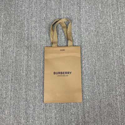 Cina 200pcs al nastro dei sacchi di carta dell'abbigliamento di timbratura di oro 500pcs tratta i sacchetti della spesa di Kraft in vendita