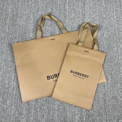 Cina 200pcs al nastro dei sacchi di carta dell'abbigliamento di timbratura di oro 500pcs tratta i sacchetti della spesa di Kraft in vendita