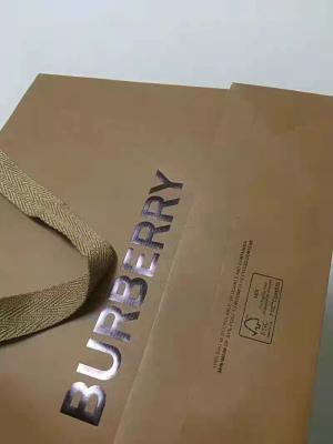 Cina 200pcs al nastro dei sacchi di carta dell'abbigliamento di timbratura di oro 500pcs tratta i sacchetti della spesa di Kraft in vendita