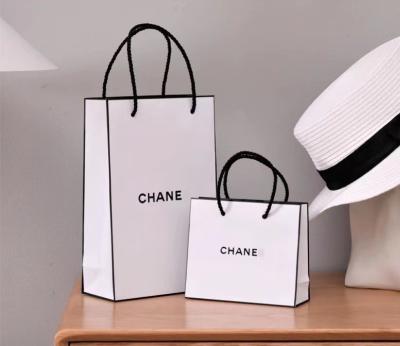 Cina Sacchetti della spesa della carta di abitudine delle scarpe che bronzano le borse d'argento di favore dell'avorio 250gsm in vendita