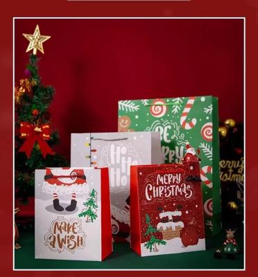 Cina sacchi di carta del regalo di Natale di 26*32*12cm in vendita