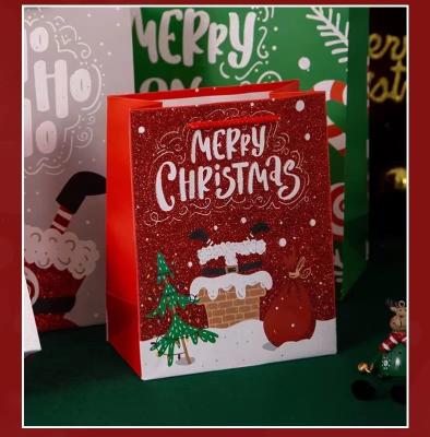 Cina sacchi di carta del regalo di Natale di 26*32*12cm in vendita