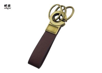 China Antique Bronze Metal Leather Strap Keychain , 42g Personalised Leather Key Fob for sale
