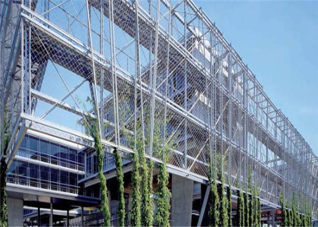 Close-up of stainless steel rope mesh green wall