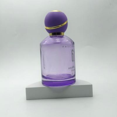 China Bottiglia di profumo a forma rotonda viola da 100 ml con tappo a sfera rotonda for sale
