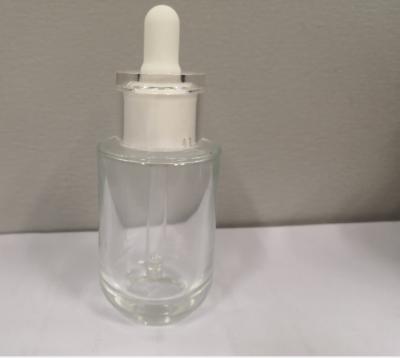 China Clear Glass Dropper Bottles Silkscreen Printing Skin Care Packaging Plastic Collar OEM for sale