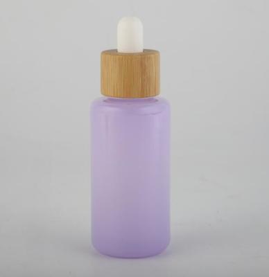 China 30ml Glass Dropper Bottles hot sell  / Glass With Bamboo Collar Essential Oil Bottles OEM for sale