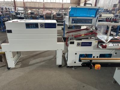 China Automatic Heat Shrink Film Wrapping Machine 220V 50Hz for Industrial Packaging for sale